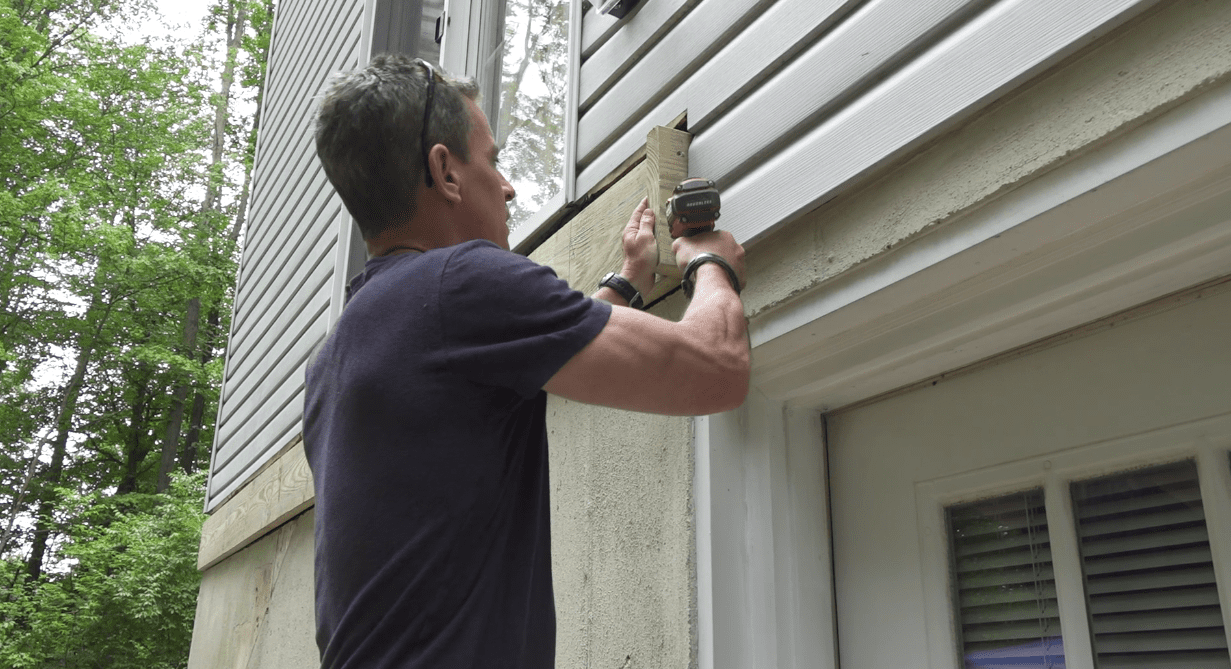 How to attach deck ledger board to house securely